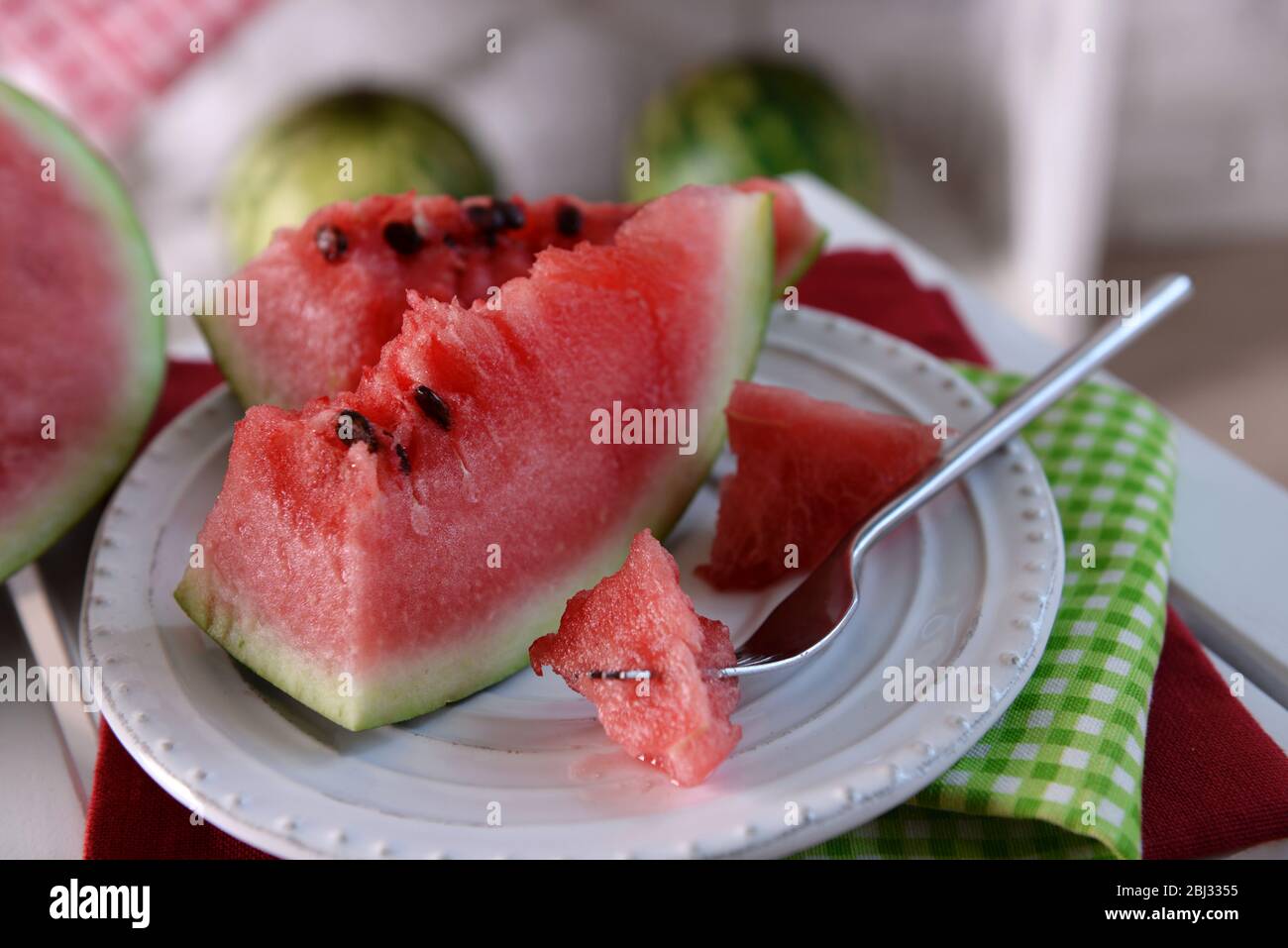Sliced watermelon on plate closeup Stock Photo - Alamy