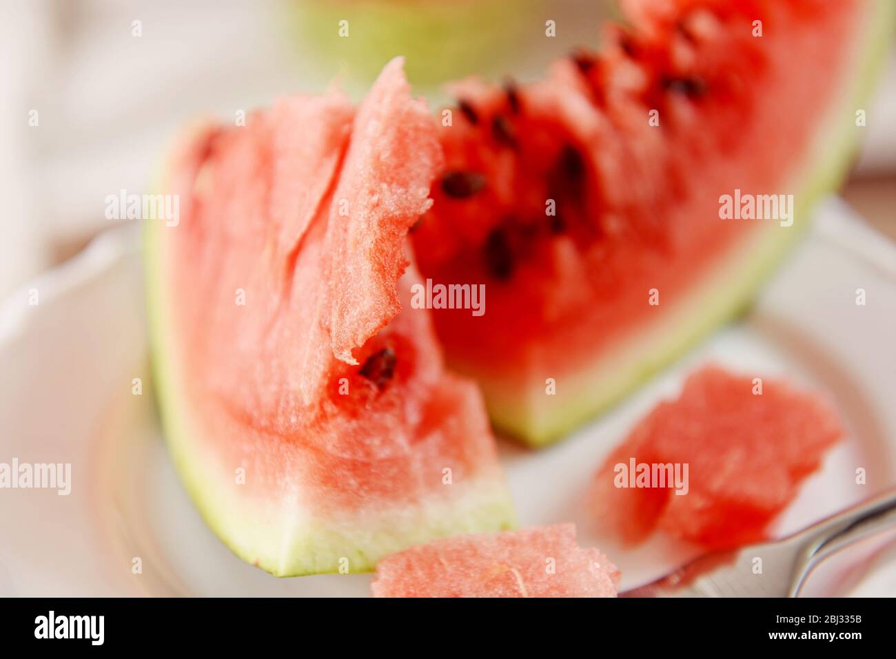 Sliced watermelon on plate closeup Stock Photo - Alamy