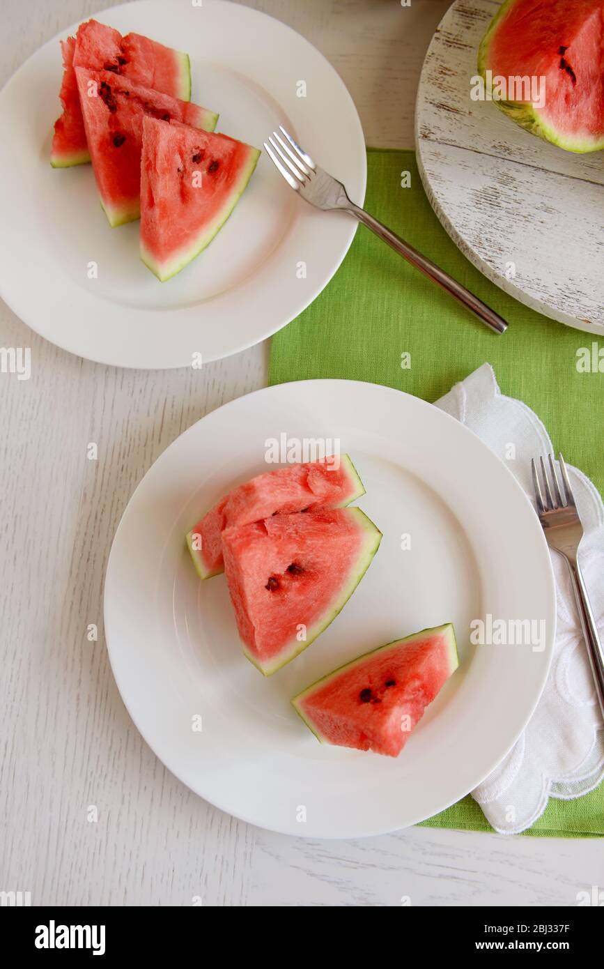 Sliced watermelon on plate closeup Stock Photo - Alamy