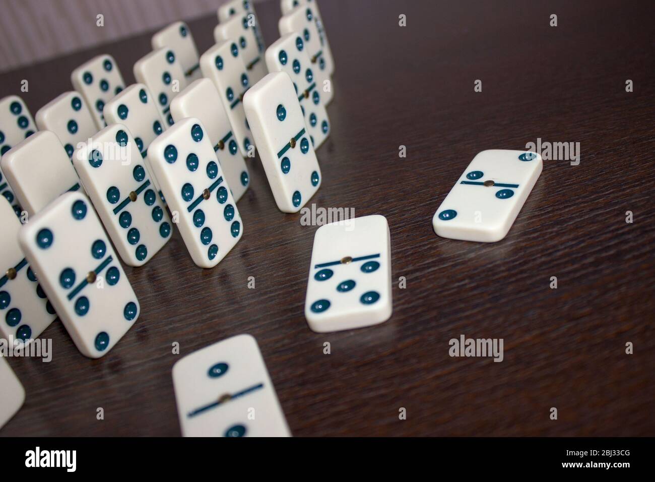 Set up dominoes on table hi-res stock photography and images - Alamy