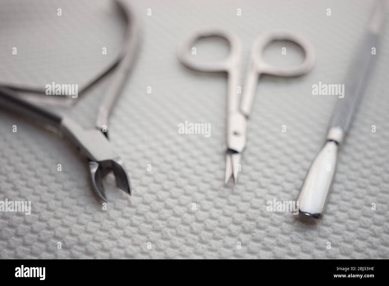 Set of tools for manicure on the white table closeup Stock Photo - Alamy