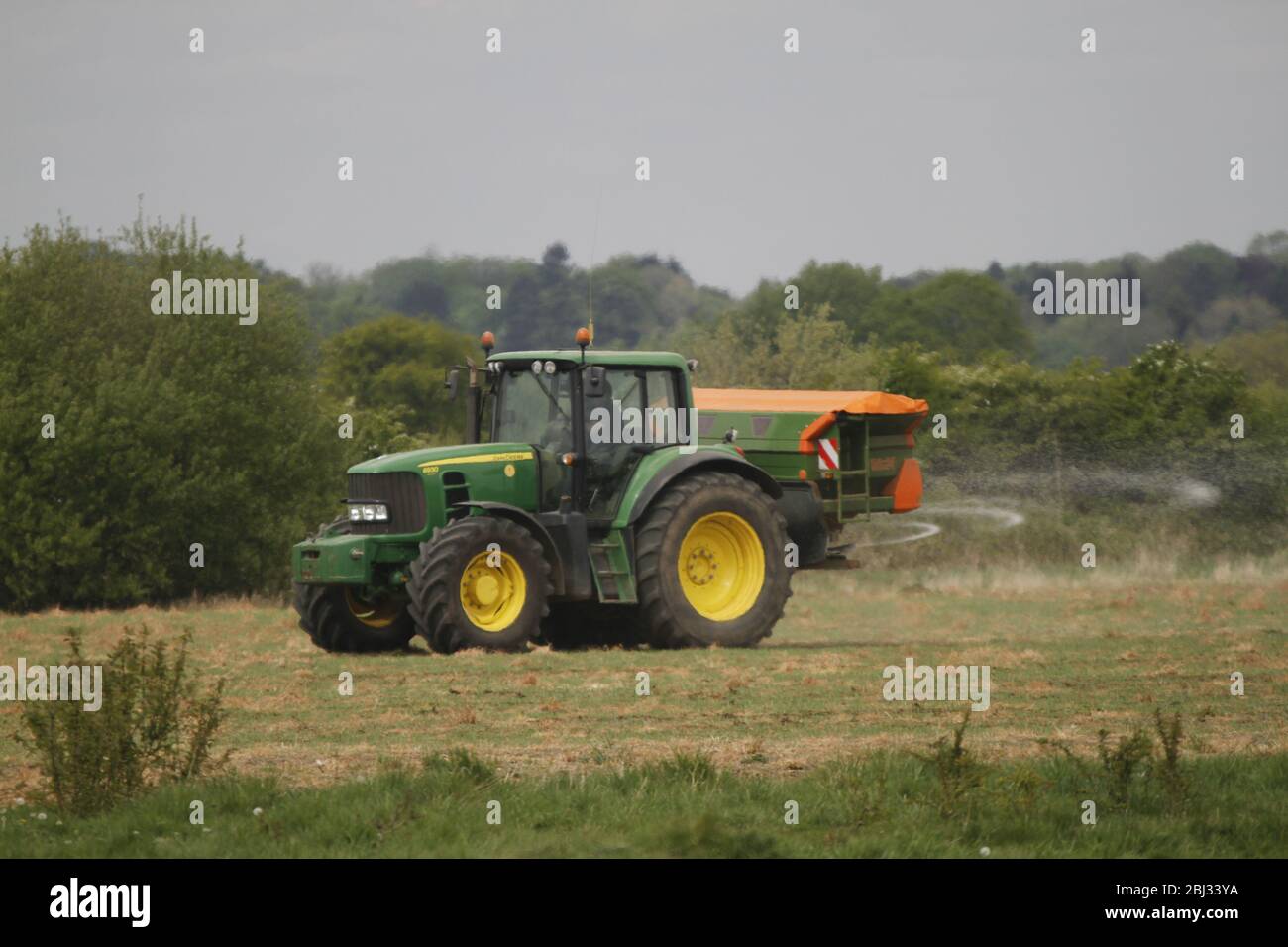 Green farm tractor spreading hi-res stock photography and images - Alamy