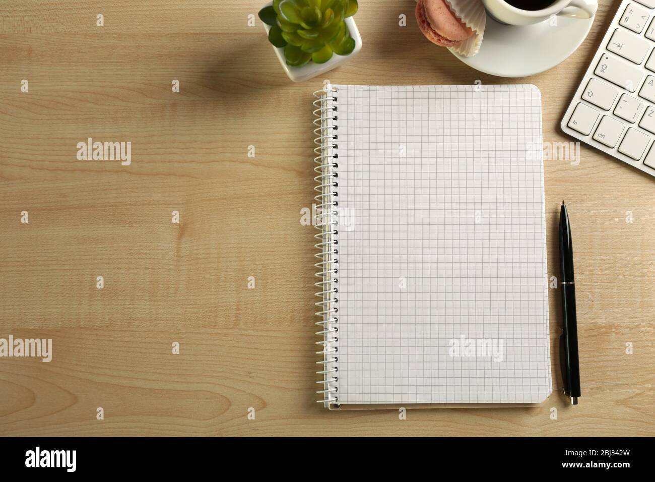 White keyboard and notebook on the desk Stock Photo - Alamy