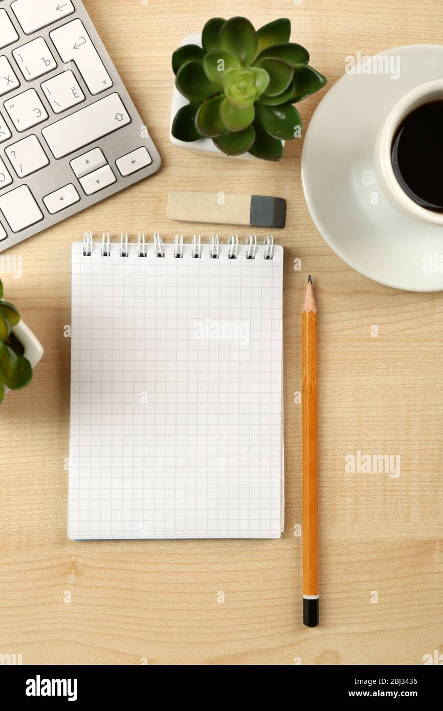 White keyboard and notebook on the desk Stock Photo - Alamy
