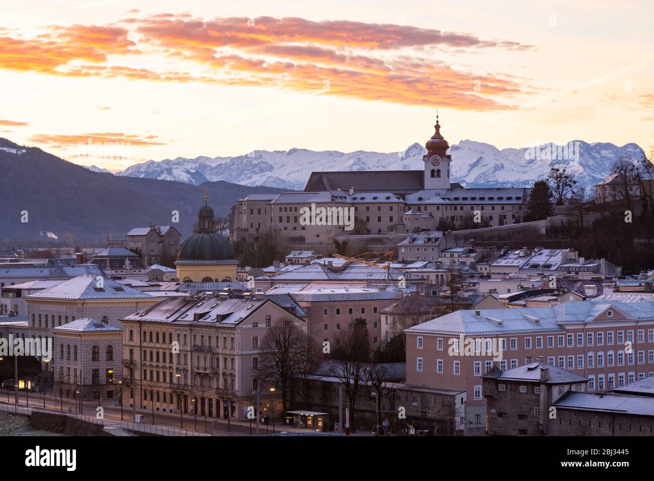 View towards Nonnberg Abbey with mountains in the background at sunrise ...