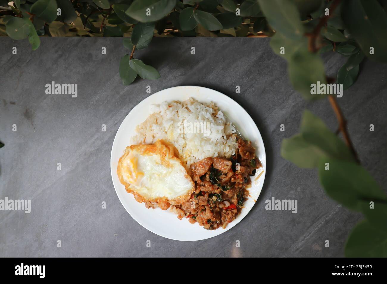 sunny side up egg and stir fried park with chilli paste and rice Stock ...