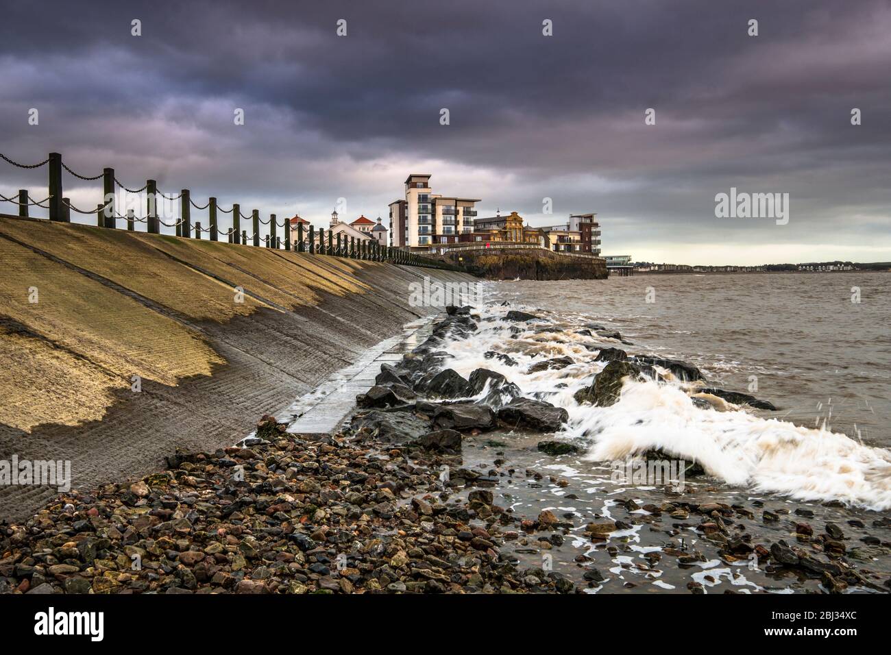 The sea wall to the marine lake with Knightstone Island behind Stock ...