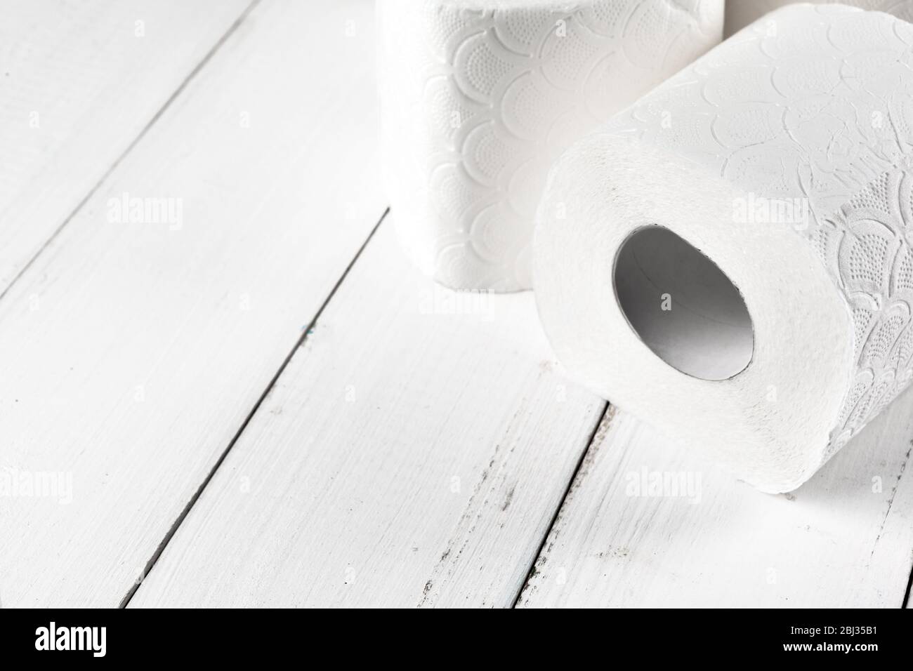 Simple toilet paper, close up side view Stock Photo - Alamy