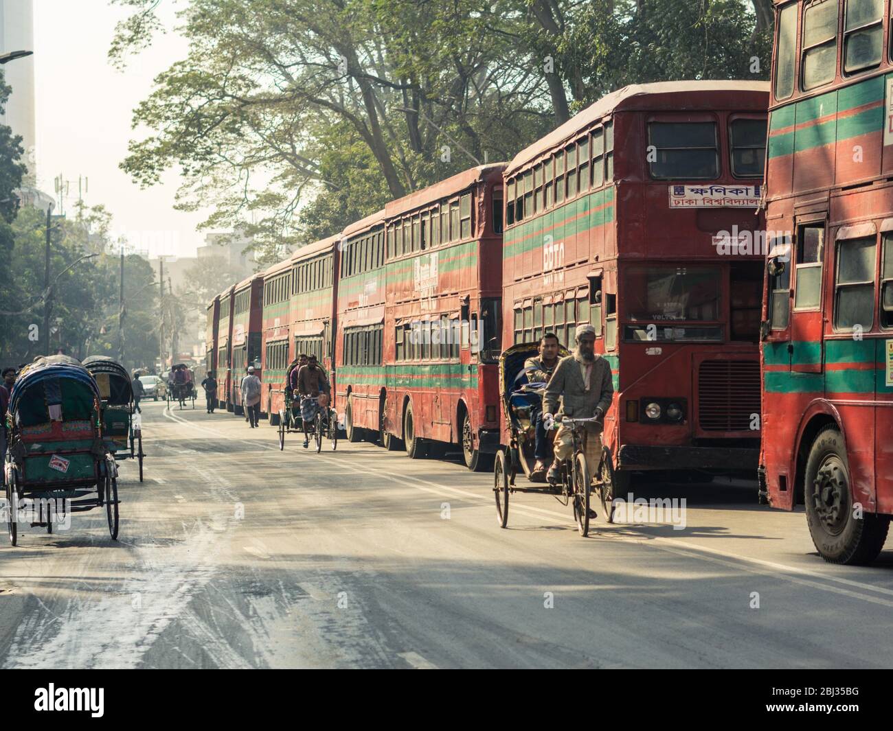 Dhaka / Bangladesh - January 14, 2019: rickshaw in avenue with large ...