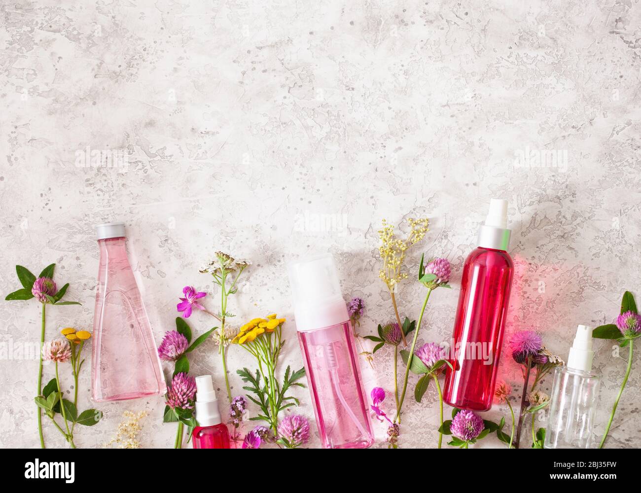 bottles skincare lotion serum medical flowers herbs. natural cosmetic ...
