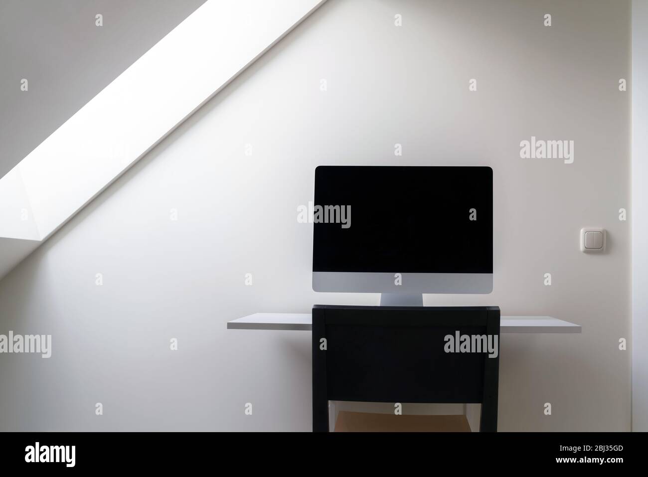 Computer with blank screen on the desk at home office. Working from ...