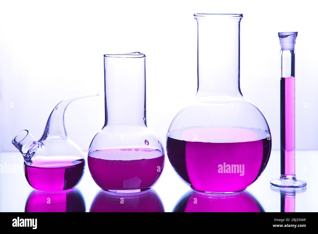 laboratory glassware with colorful chemical Stock Photo - Alamy