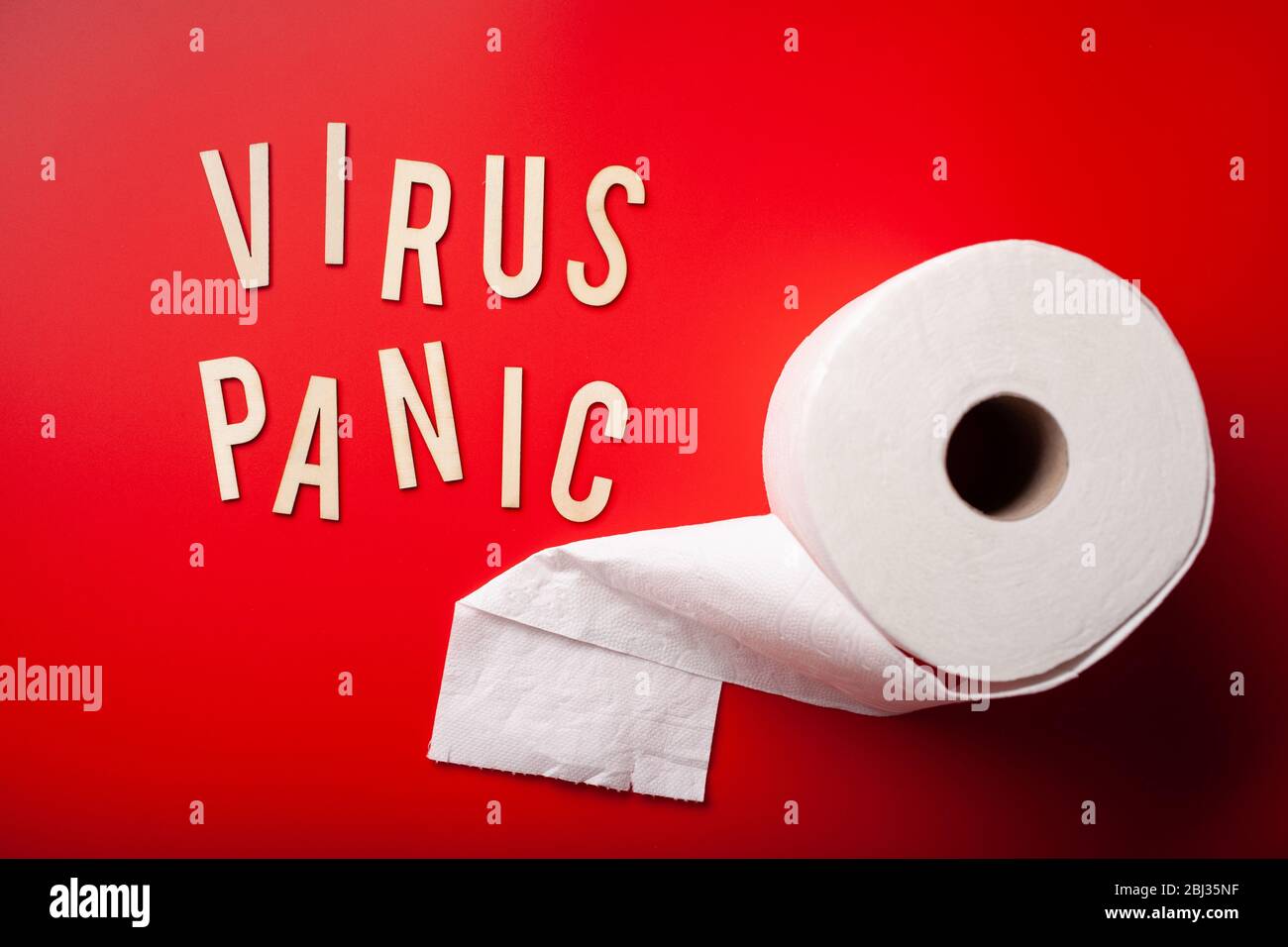 virus panic word text wooden letter toilet paper on red background ...