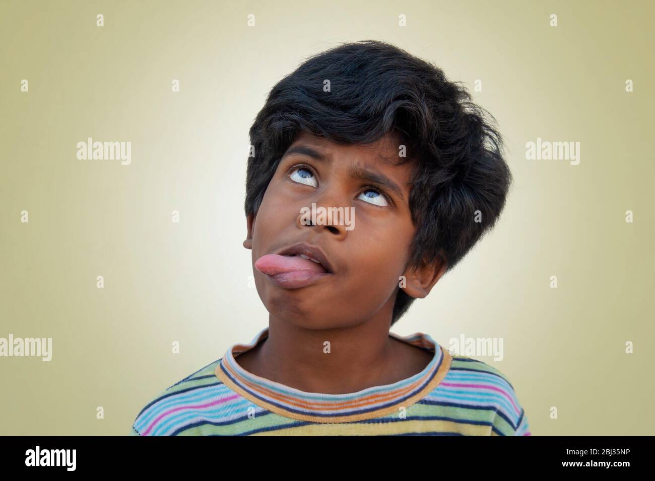 Indian child face tongue hi-res stock photography and images - Alamy