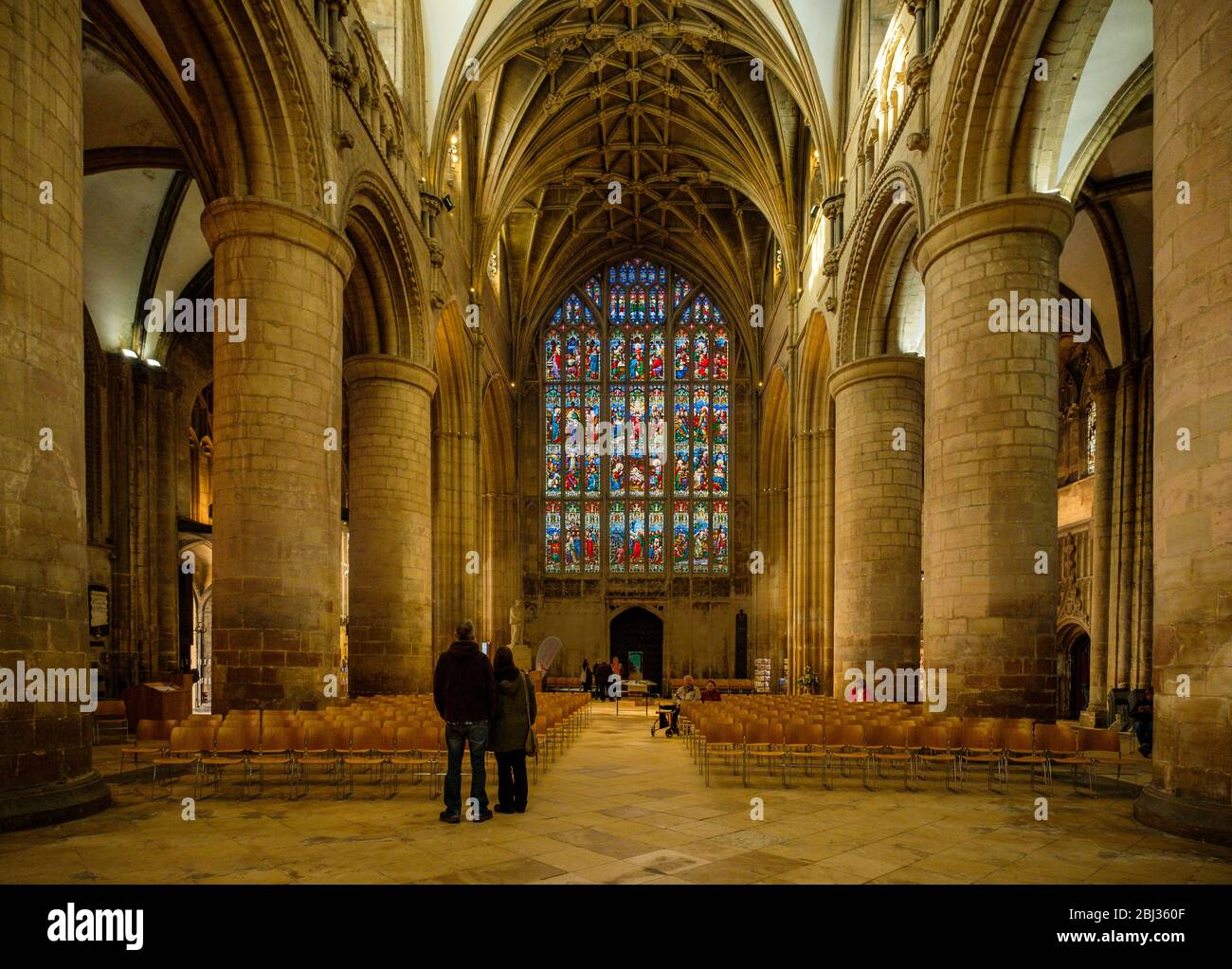 The interior of Gloucester Cathedral with its stained glass West window ...