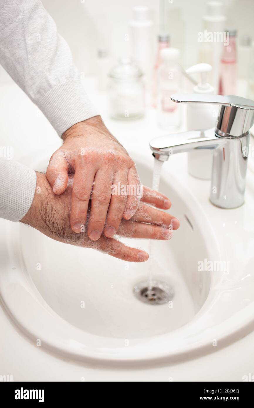 Man washing hands hi-res stock photography and images - Alamy