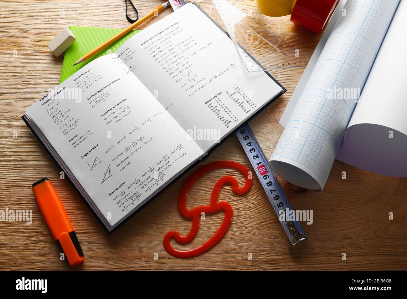 School supplies and textbook on mathematics close up Stock Photo - Alamy