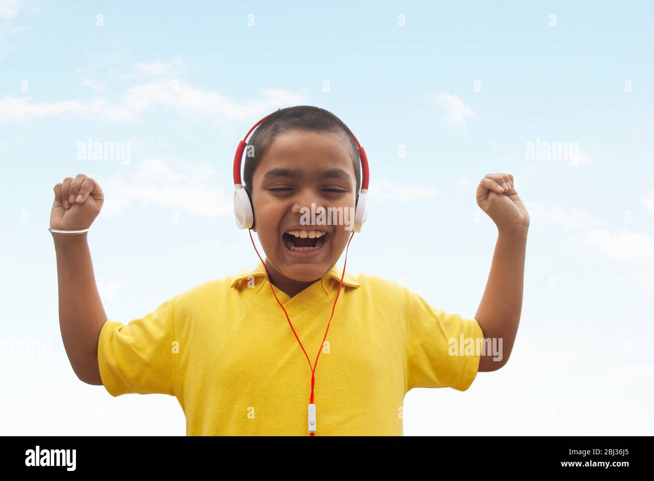 Boy Screaming While Listening Music Stock Photo - Alamy