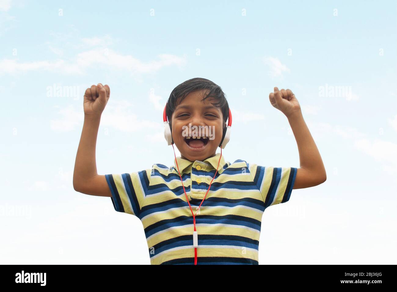 Boy Screaming While Listening Music Stock Photo - Alamy