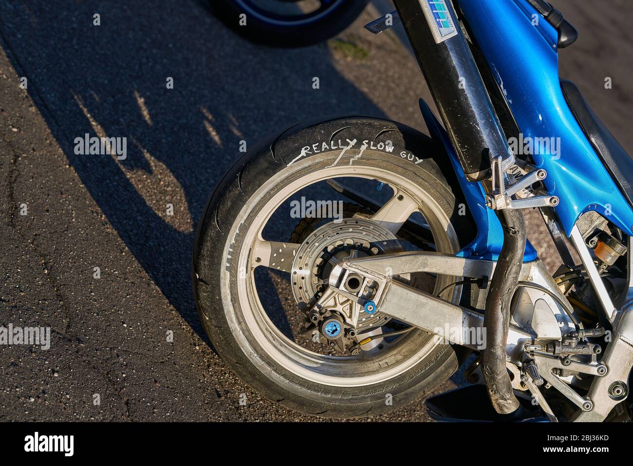 Rear wheel of blue sport motorcycle Stock Photo - Alamy