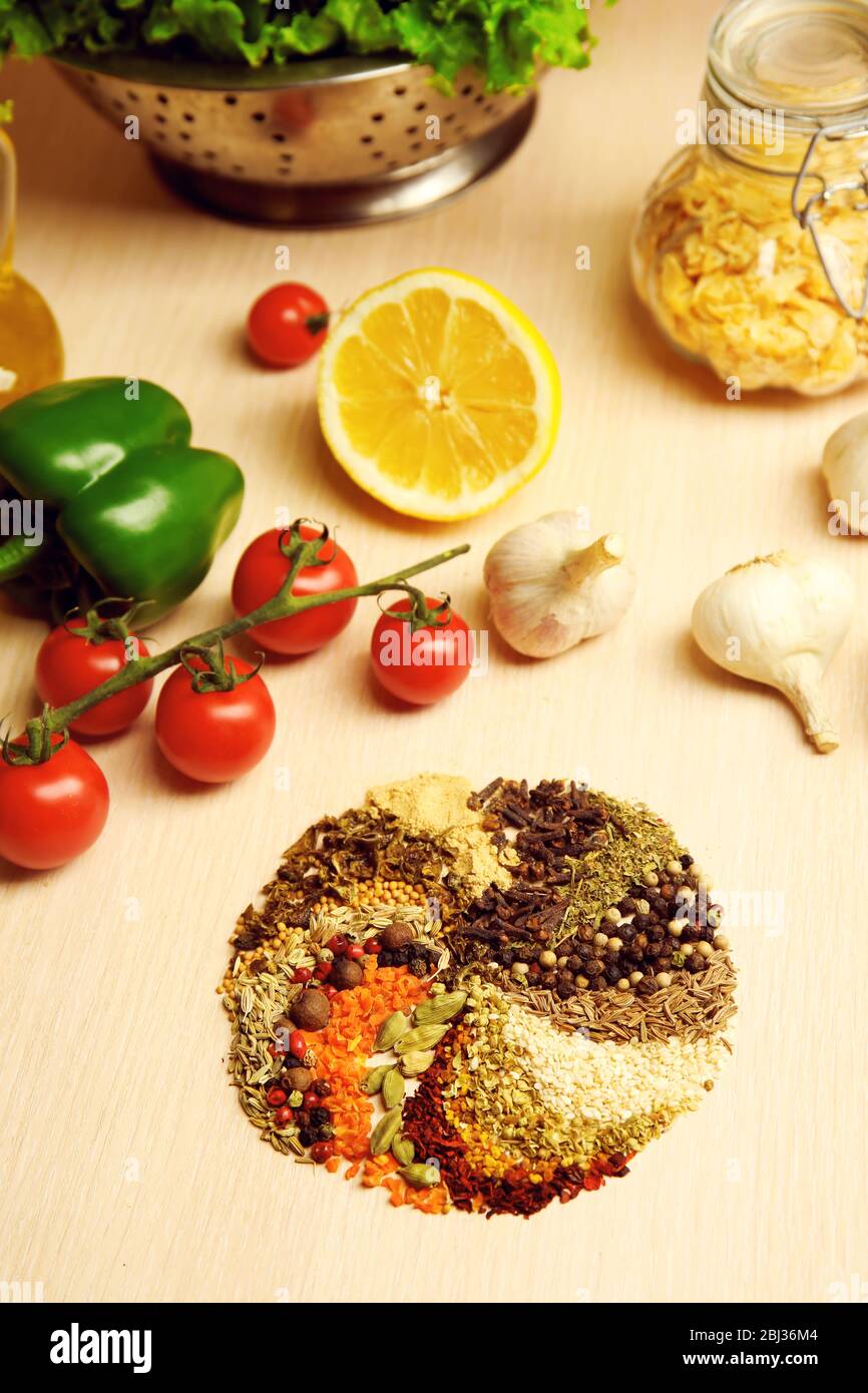 Variety of spices in the shape of a circle on the kitchen table Stock ...