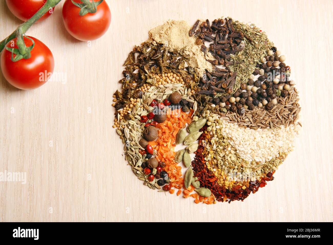 Variety of spices in the shape of a circle on the kitchen table Stock ...