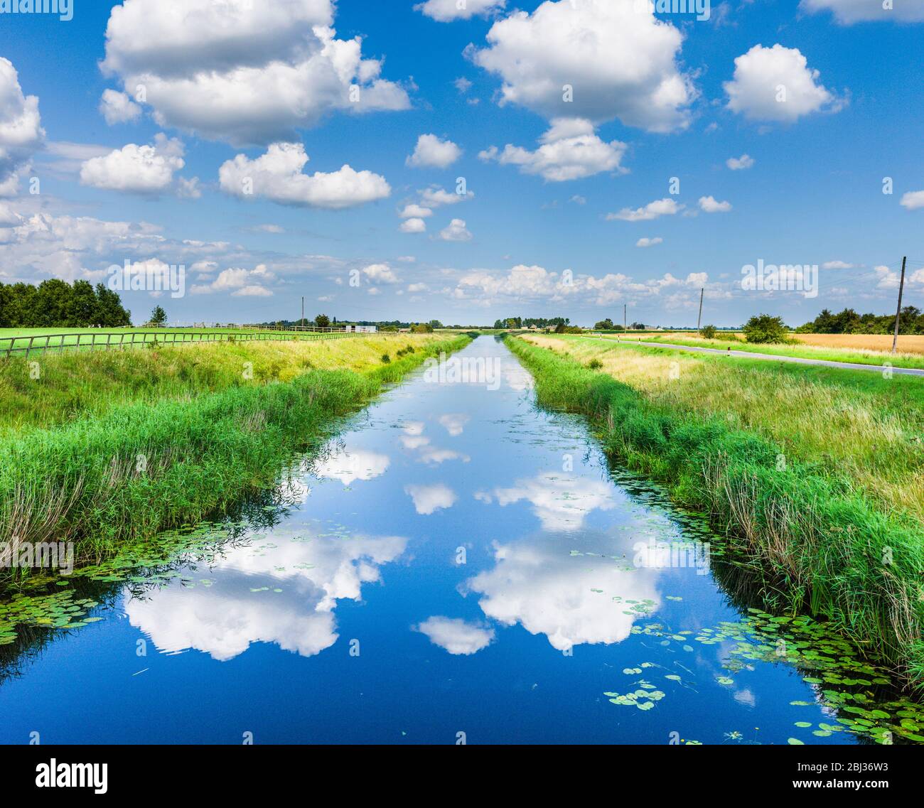 Fluffy white clouds over the sixteen foot drain in Cambridgeshire ...