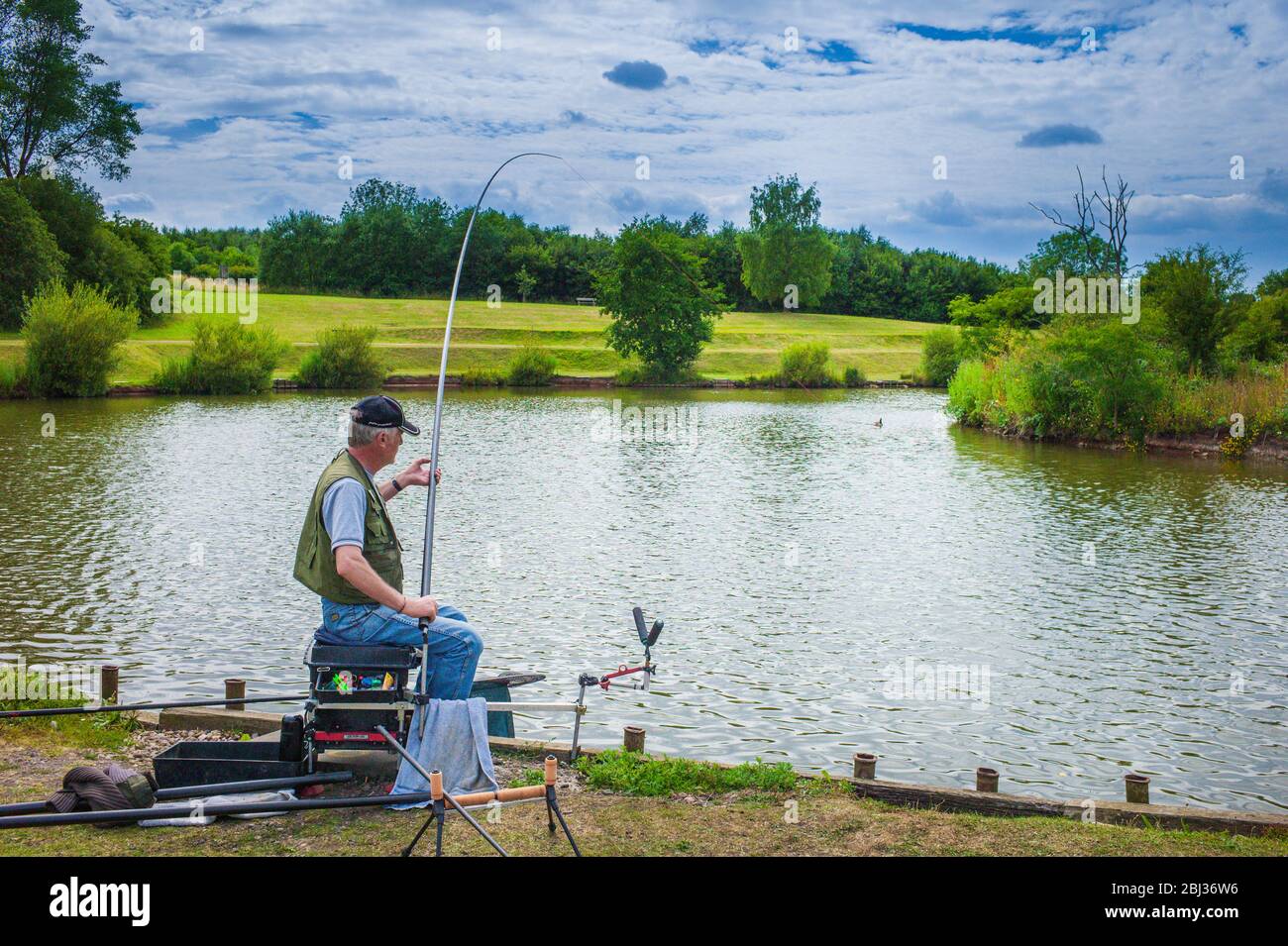 An angler plays a good fish Stock Photo - Alamy
