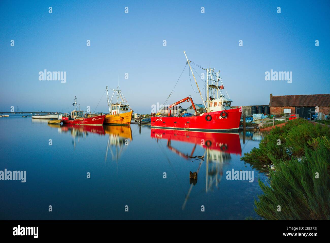 Fishing boats in the harbour at Brancaster Staithe Stock Photo - Alamy