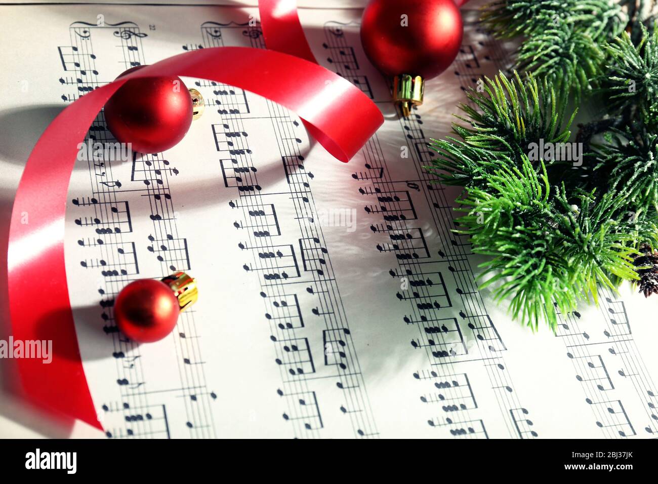 Christmas decor on music notes background Stock Photo - Alamy