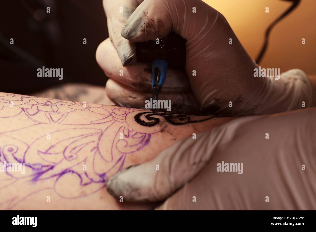 Process of making tattoo close-up Stock Photo - Alamy