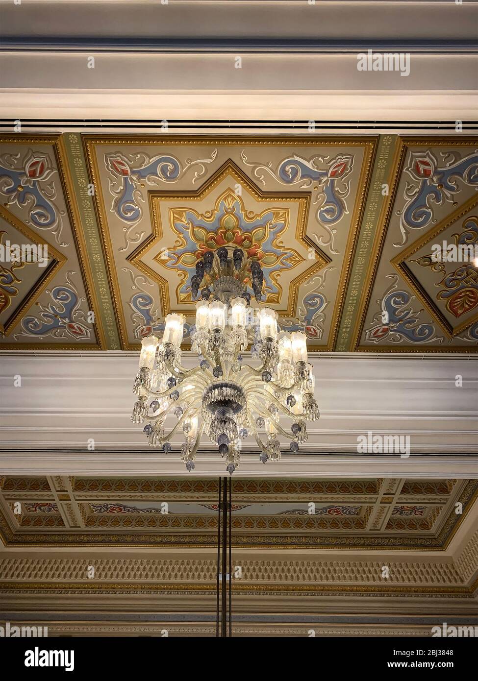 View of historical, old, classical chandelier and ornamental ceiling ...