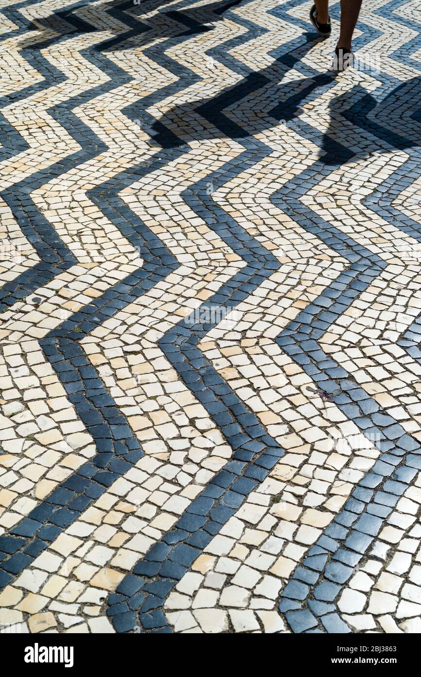 Walker and geometric tiles form shapes and patterns of wavy lines on ...