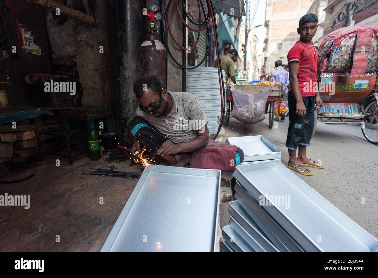 Dhaka / Bangladesh - January 14, 2019: man welding metal plates with ...