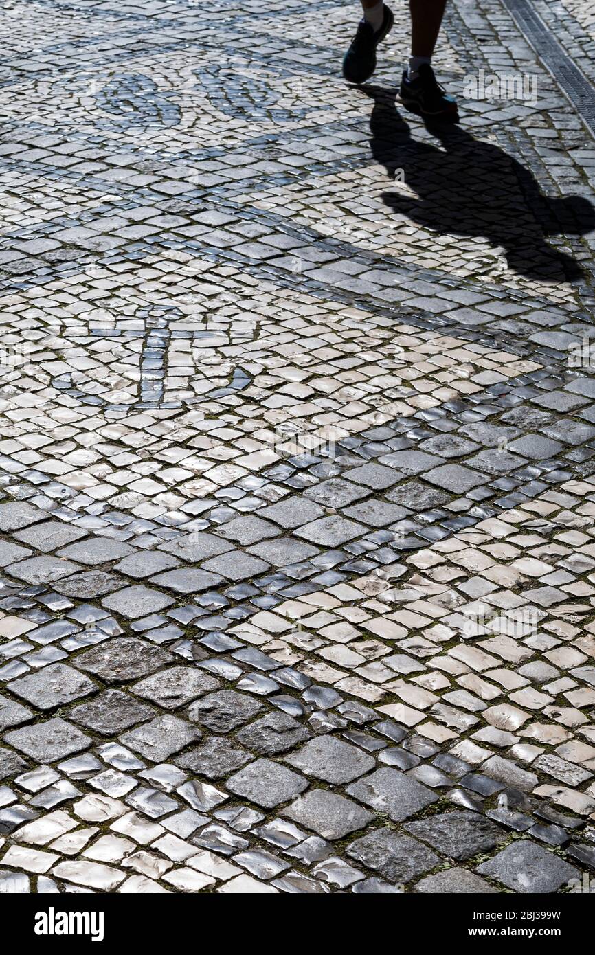 Man walking on paving hi-res stock photography and images - Alamy