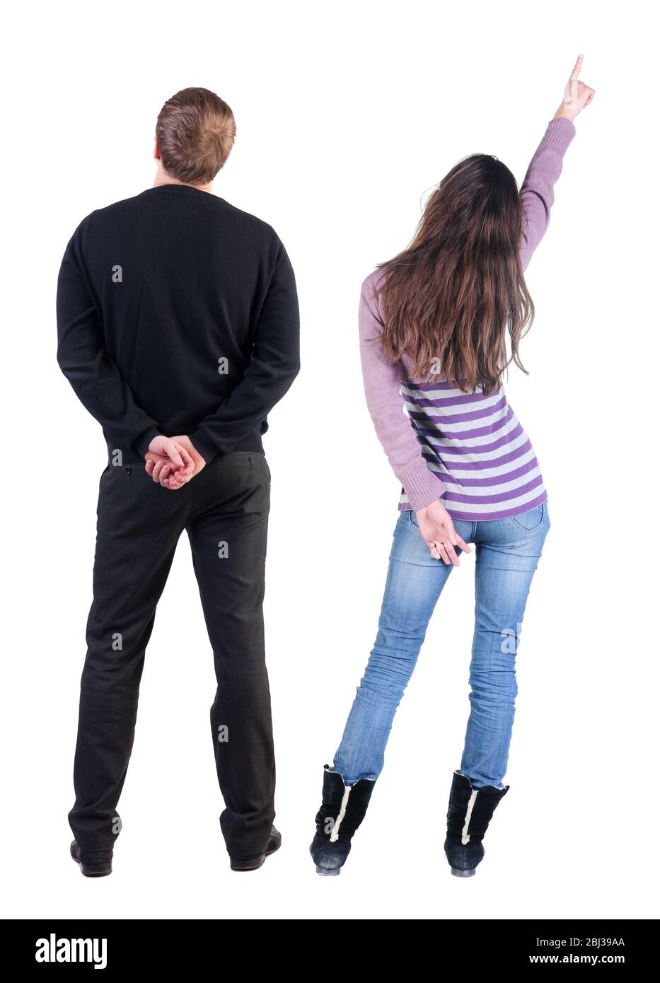 Back view of couple in sweater pointing. Rear view people collection ...