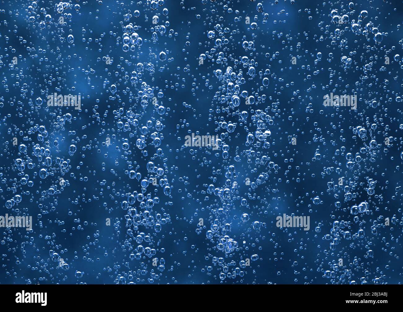 Texture effervescent bubbles on a blue background Stock Photo - Alamy