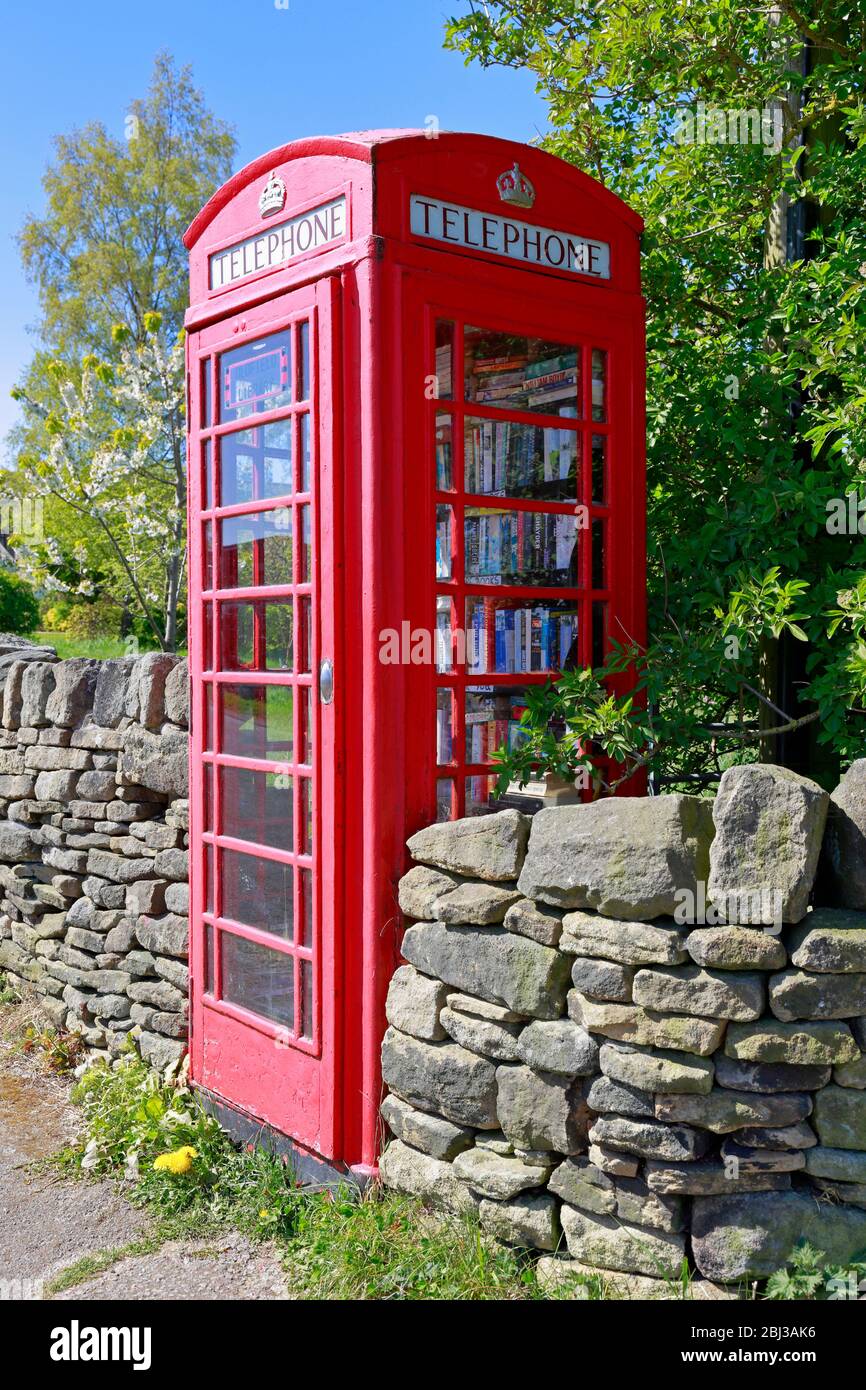 Old red telephone box now used as a free library in rural West ...