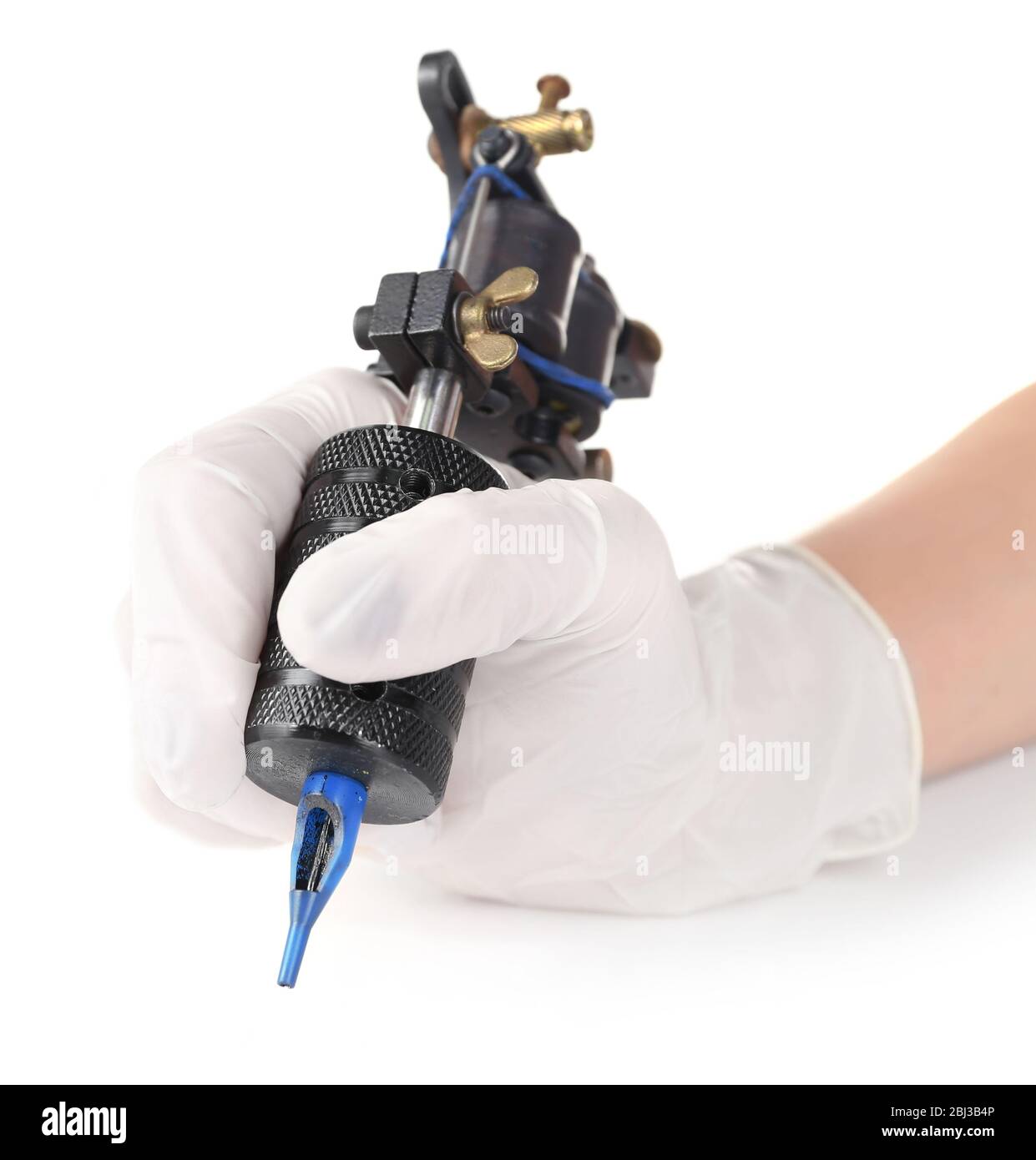 Tattoo machine in hand isolated on white background Stock Photo - Alamy