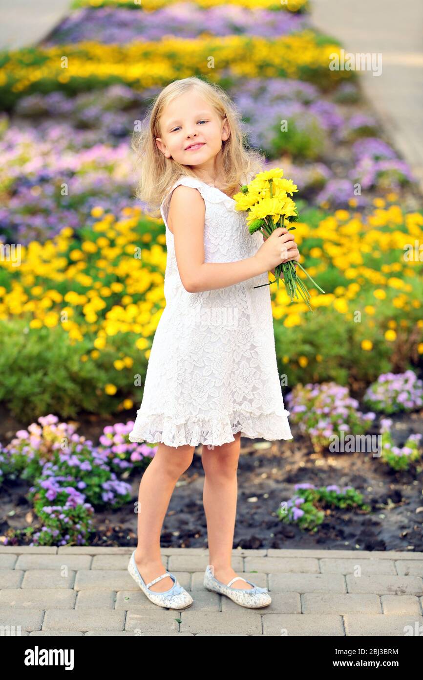 Happy girl walking in park Stock Photo - Alamy