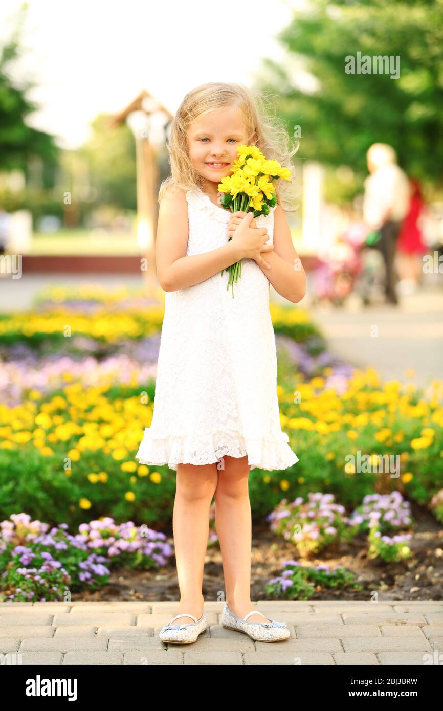 Happy girl walking in park Stock Photo - Alamy