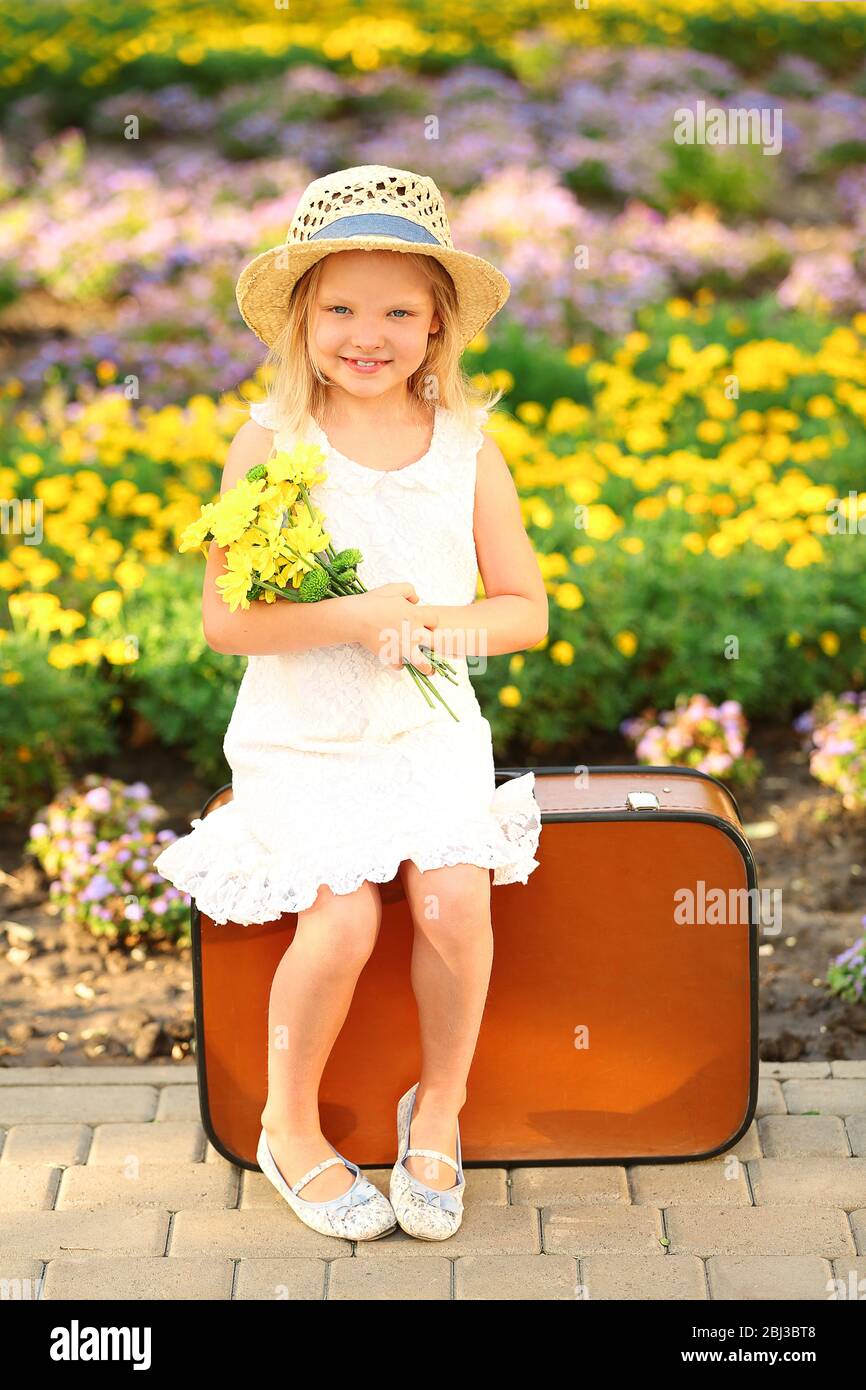 Happy girl walking in park Stock Photo - Alamy