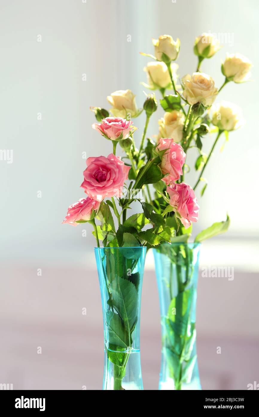 Beautiful spring flowers in vase on window background Stock Photo - Alamy