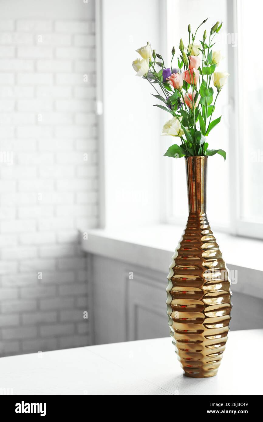 Beautiful spring flowers in vase on window background Stock Photo - Alamy