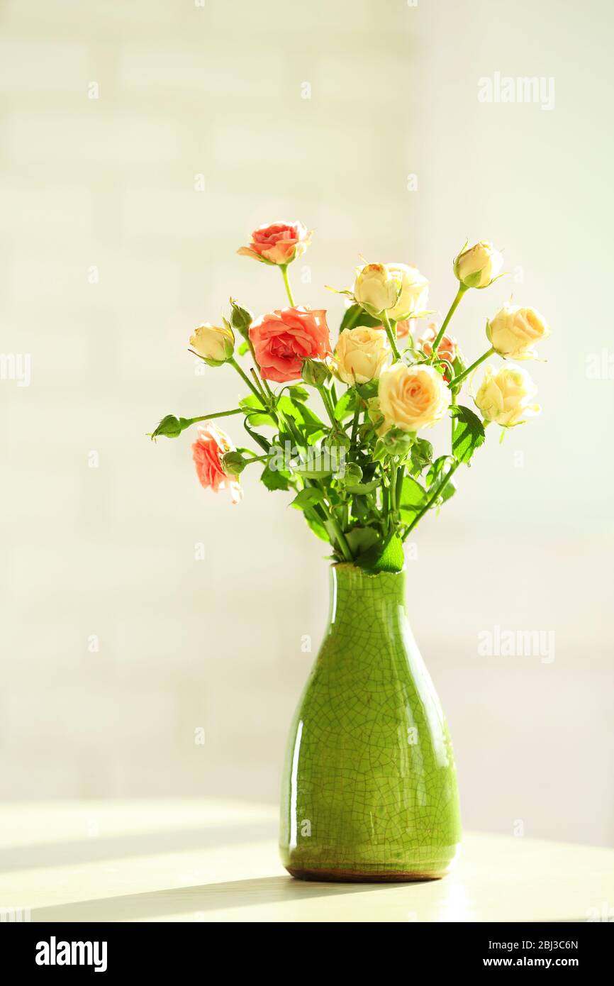 Beautiful spring flowers in vase on window background Stock Photo - Alamy