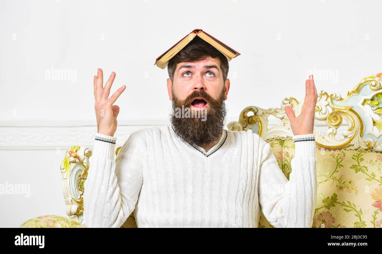 Lose mind concept. Man on crazy face with beard and mustache sits on ...