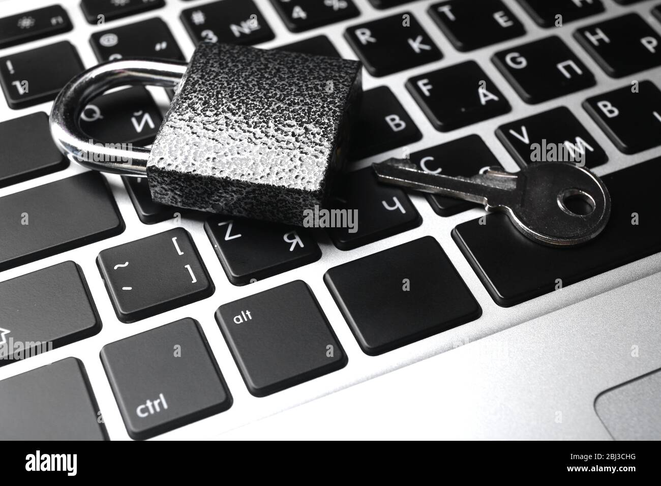 Lock on the laptop keyboard background, close up Stock Photo - Alamy