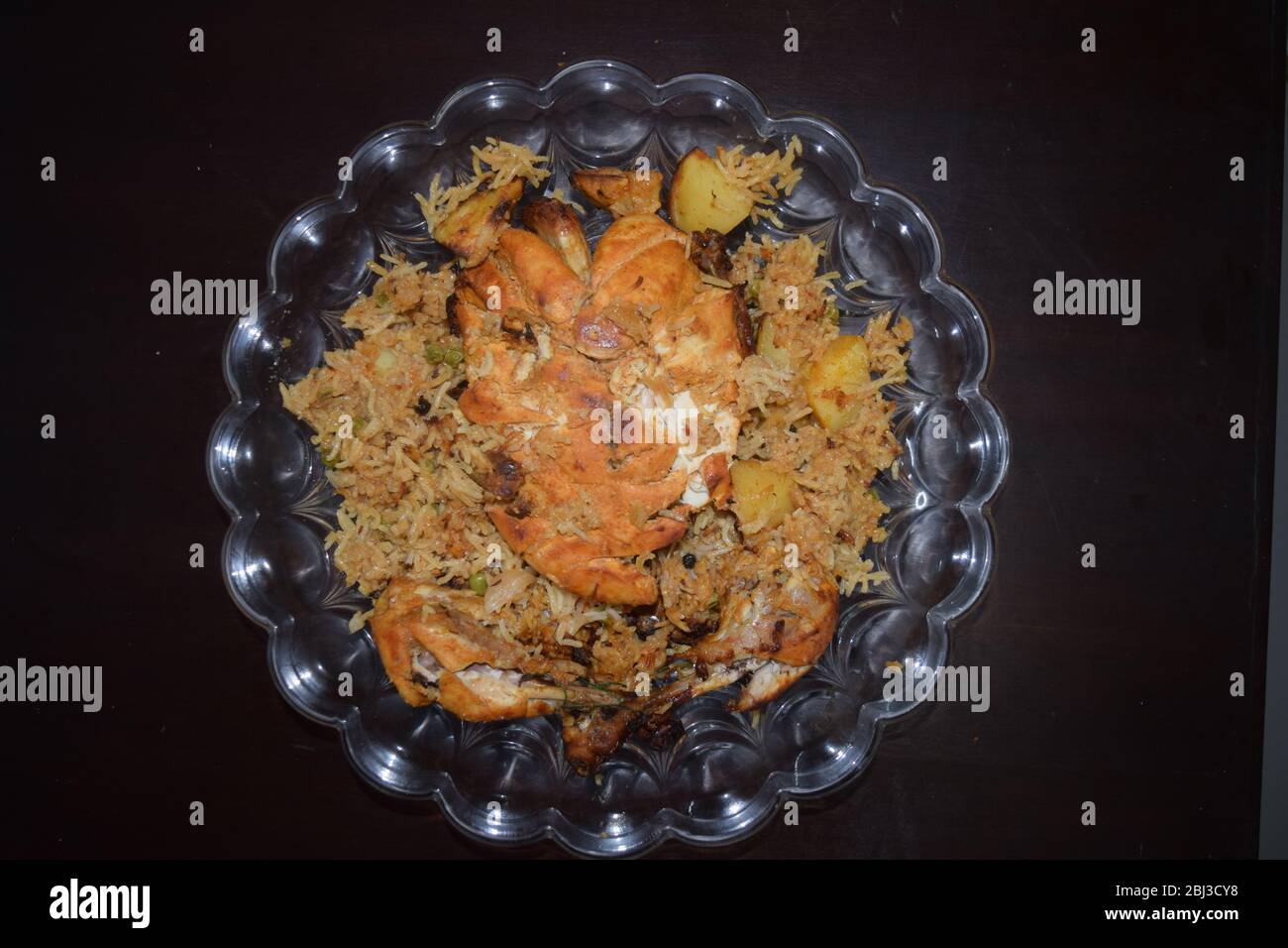 Roasted whole chicken with stuffed rice and potato Stock Photo - Alamy