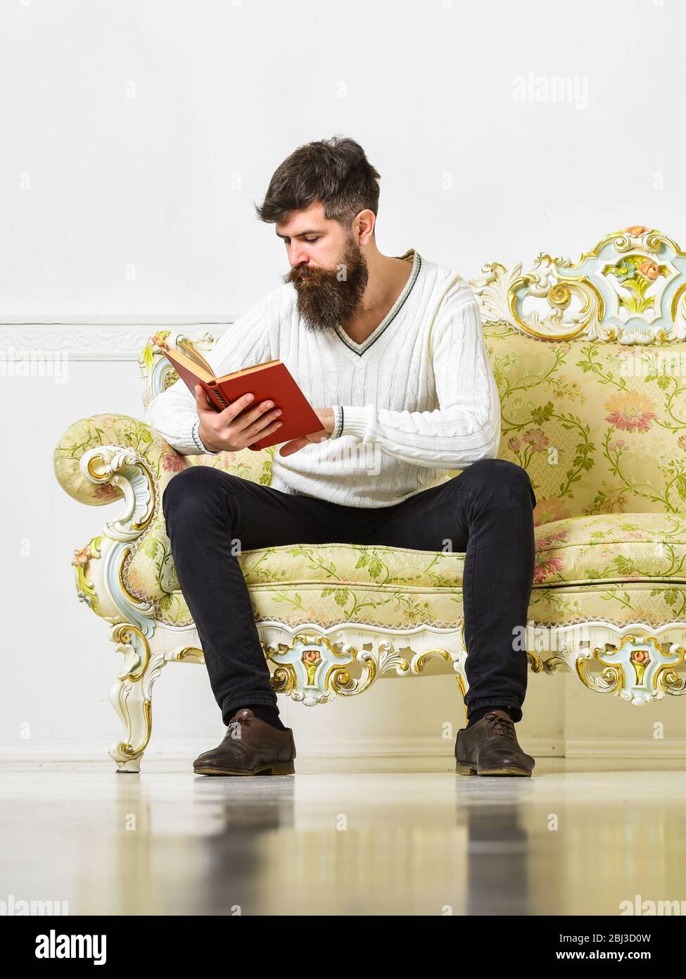 Self improvement concept. Guy reading book with attention. Man with ...