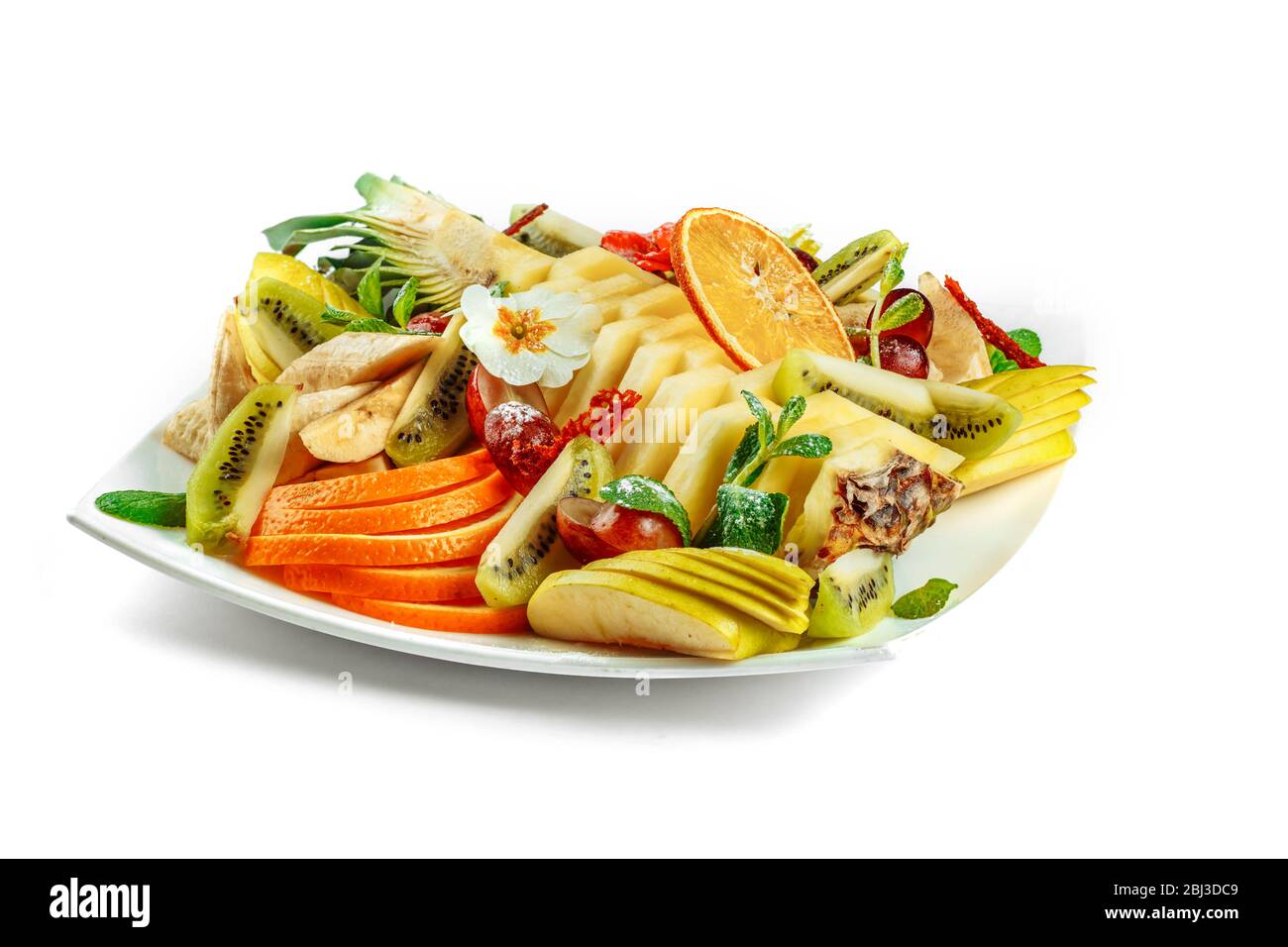Sliced assorted fruits of pineapple, apple, pear, kiwi, banana and ...